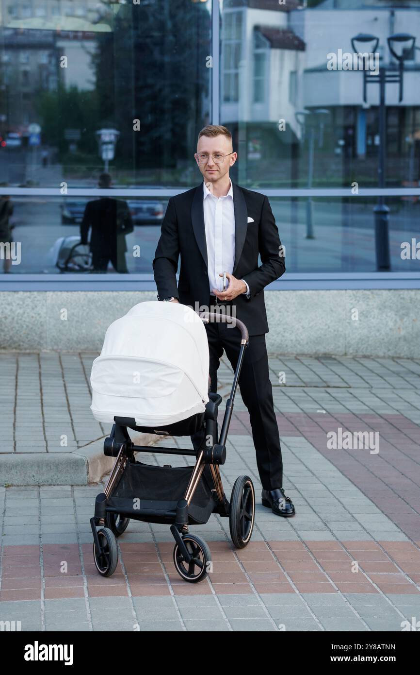 Stylishly Dapper Father Pushing a Modern Stroller in an Urban Setting ...