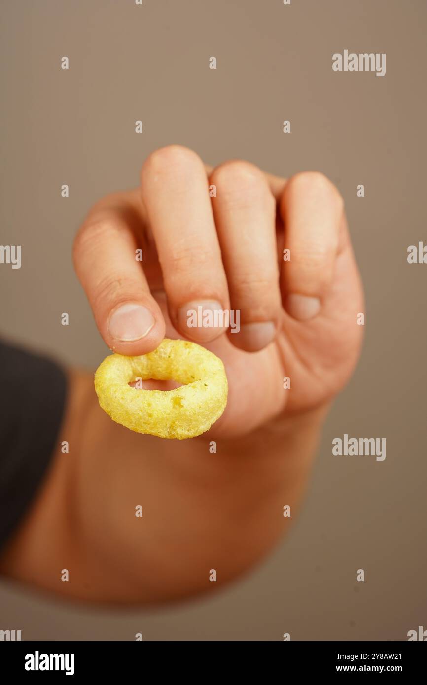 Eating onion rings. Onion ring. Deep fried onion rings. Snack for beer ...