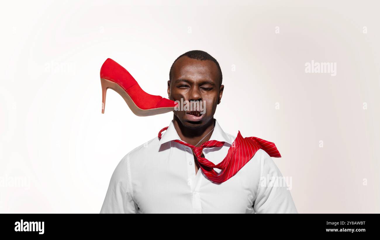 Bright red high heel shoe crashes into African-American man's face ...