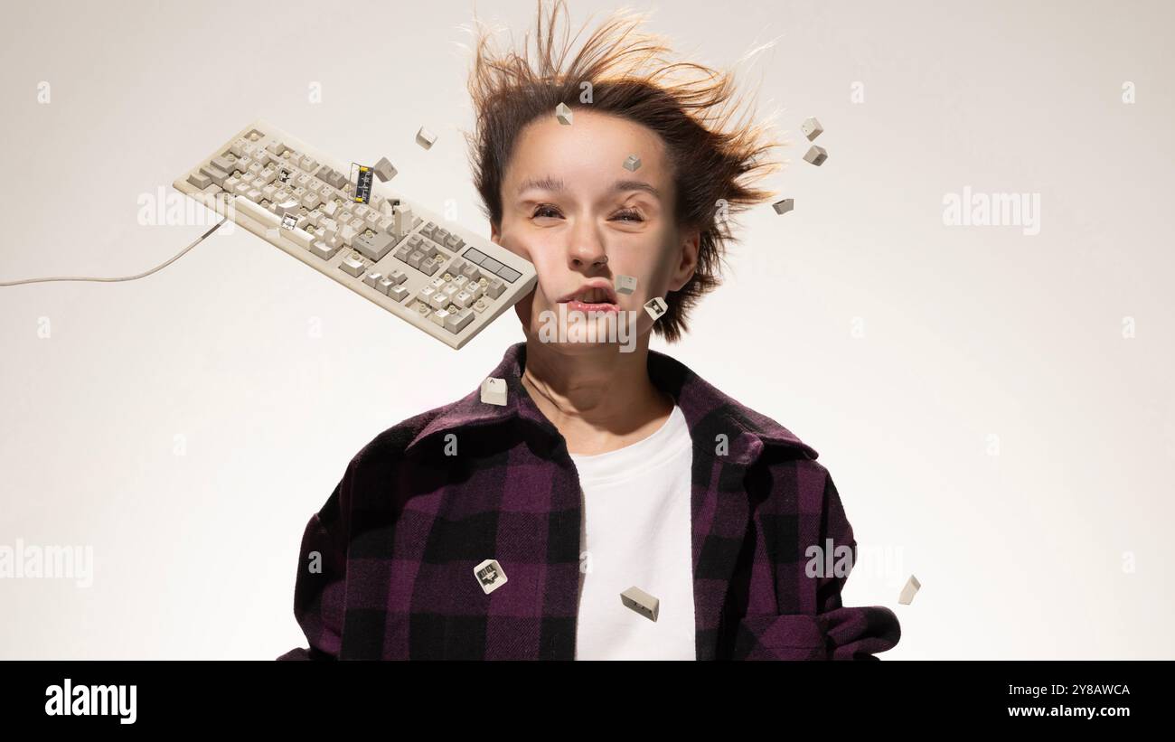 Keyboard smacks woman's face, scattering keys flying around in mid-air ...