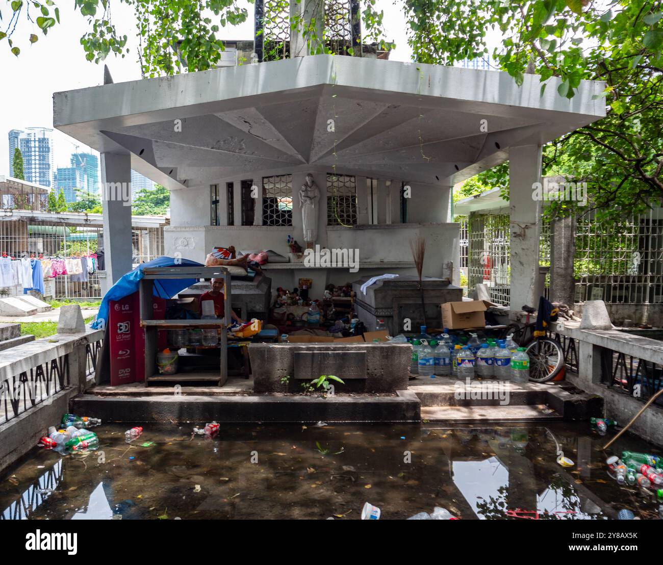 Manila, Philippines - August 26, 2019: A homeless individual lives on a ...