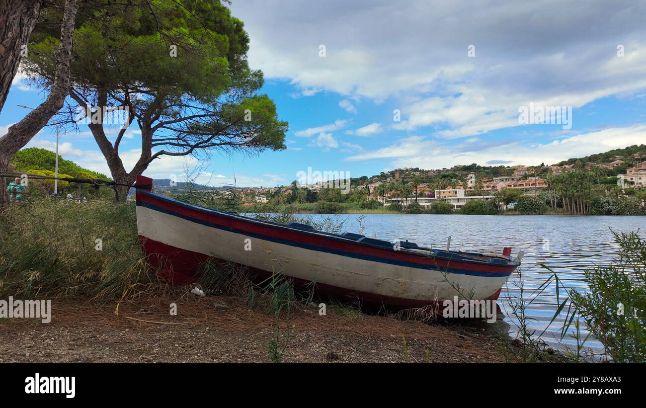 Traditional Sicilian boat on the shores of Lake Ganzirri, Messina, used ...