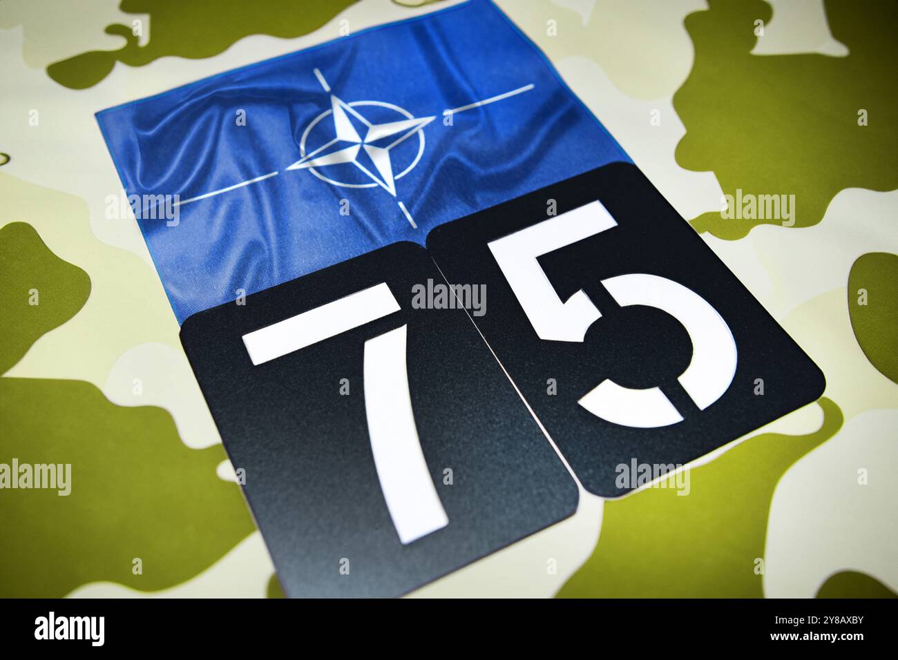 PHOTO MONTAGE, NATO flag with the number 75, symbolic photo of the ...
