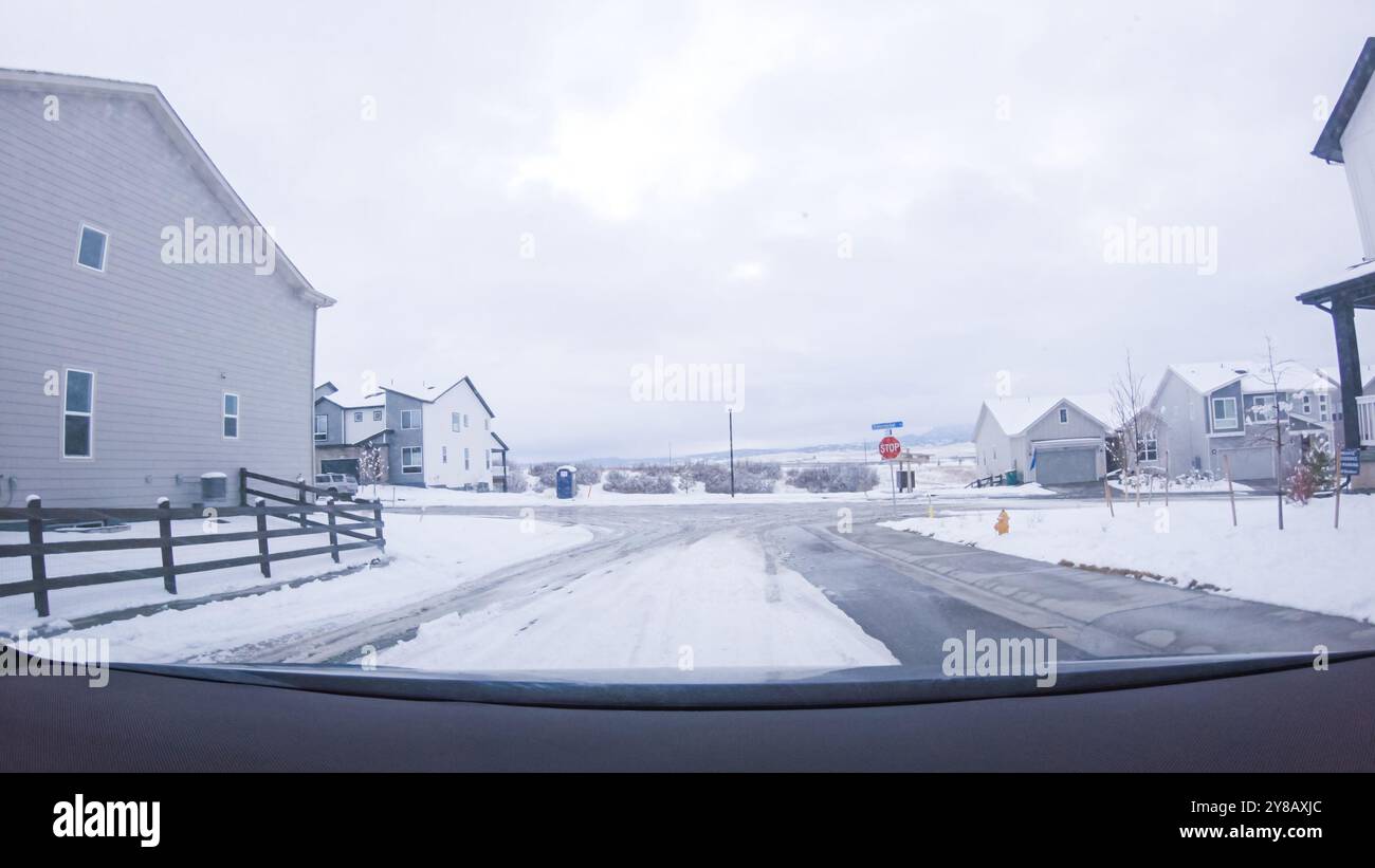 Navigating Through a Snowy Suburban Neighborhood at Dawn Stock Photo ...
