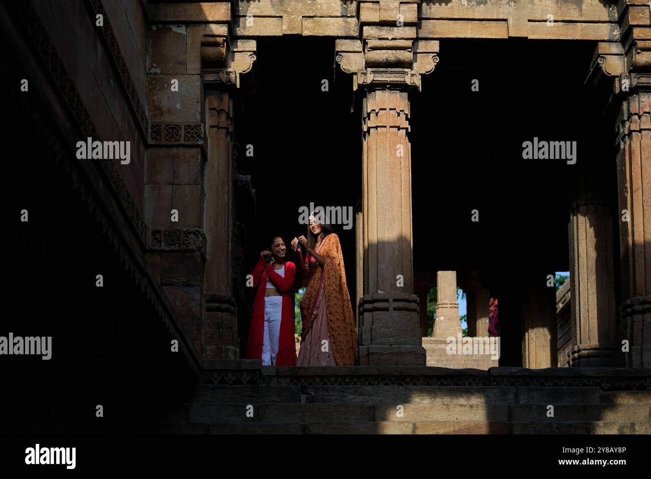 Several women in colorful, traditional Indian costumes at the historic ...