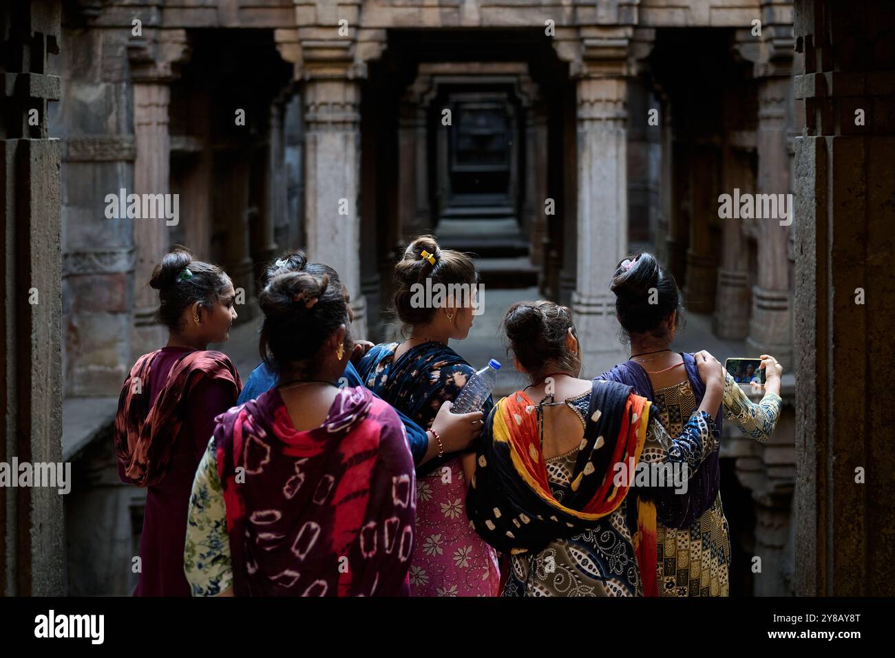 Several women in colorful, traditional Indian costumes at the historic ...