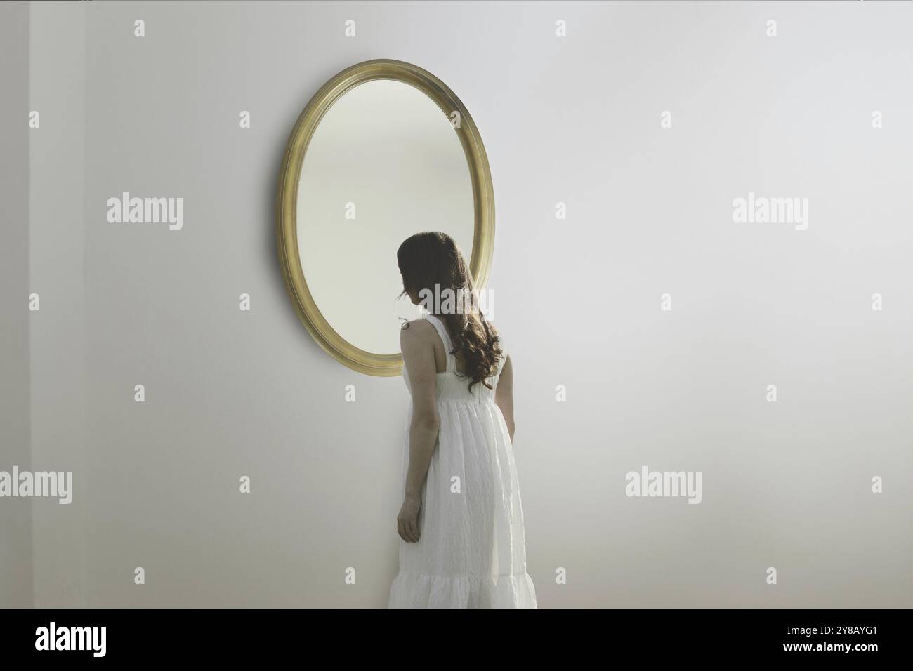 woman curiously looks into a mirror to see her image, abstract concept ...