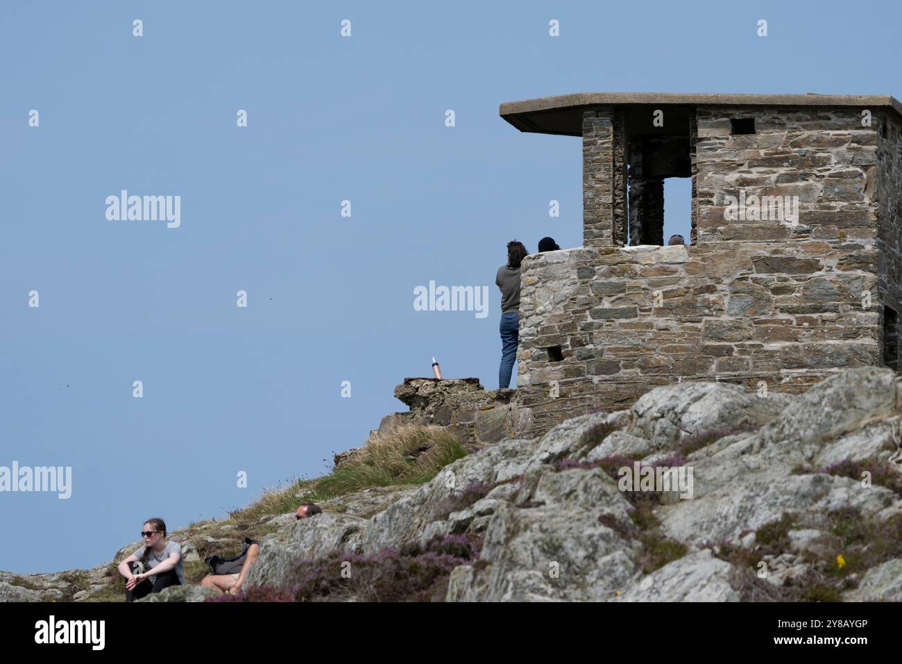 Old stone coastguard lookout overlooking South Stack lighthouse at ...
