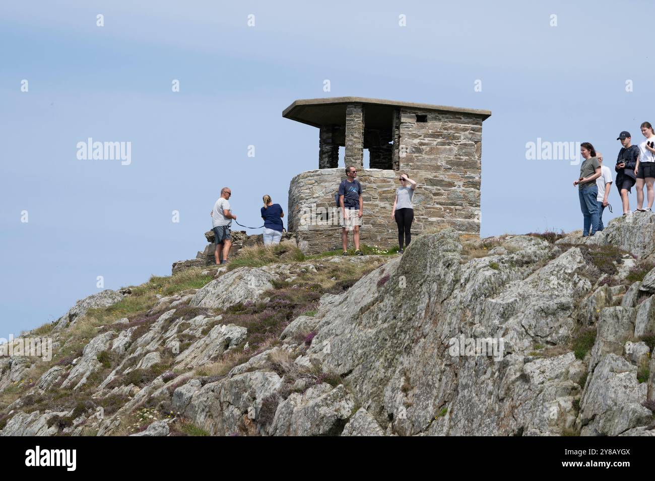 Old stone coastguard lookout overlooking South Stack lighthouse at ...