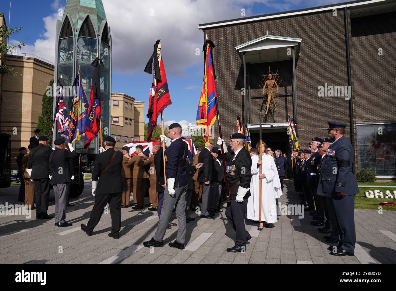 The coffin of 104-year-old D-Day veteran Don Sheppard is carried out of ...