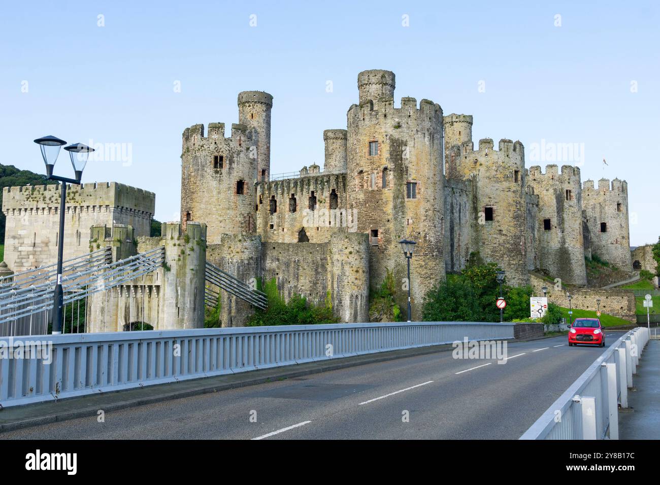 Medieval Conwy Castle and bridge with one car approaching Stock Photo ...