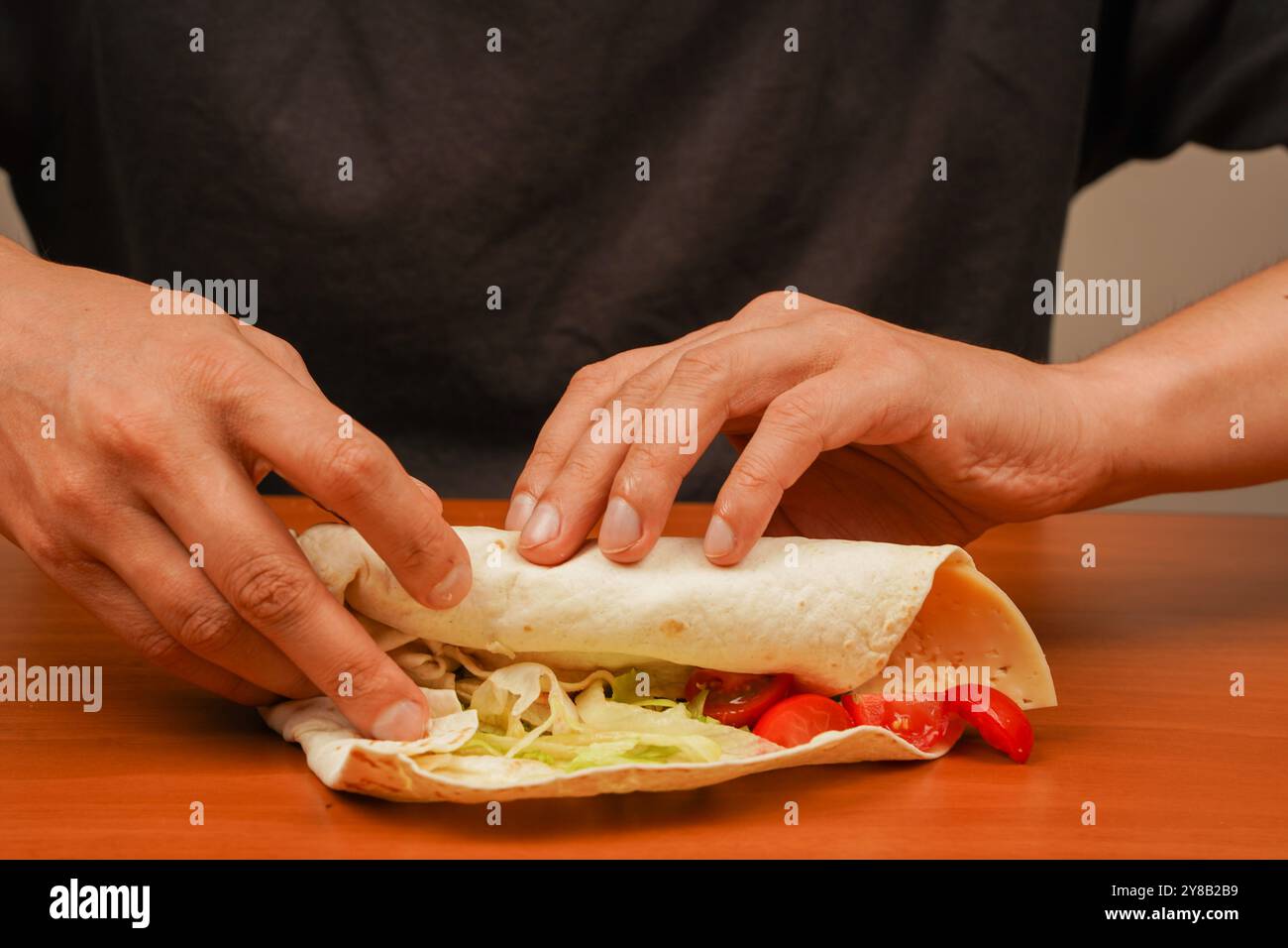 Cooking chicken roll. Tortilla wrap with fried chicken meat and ...