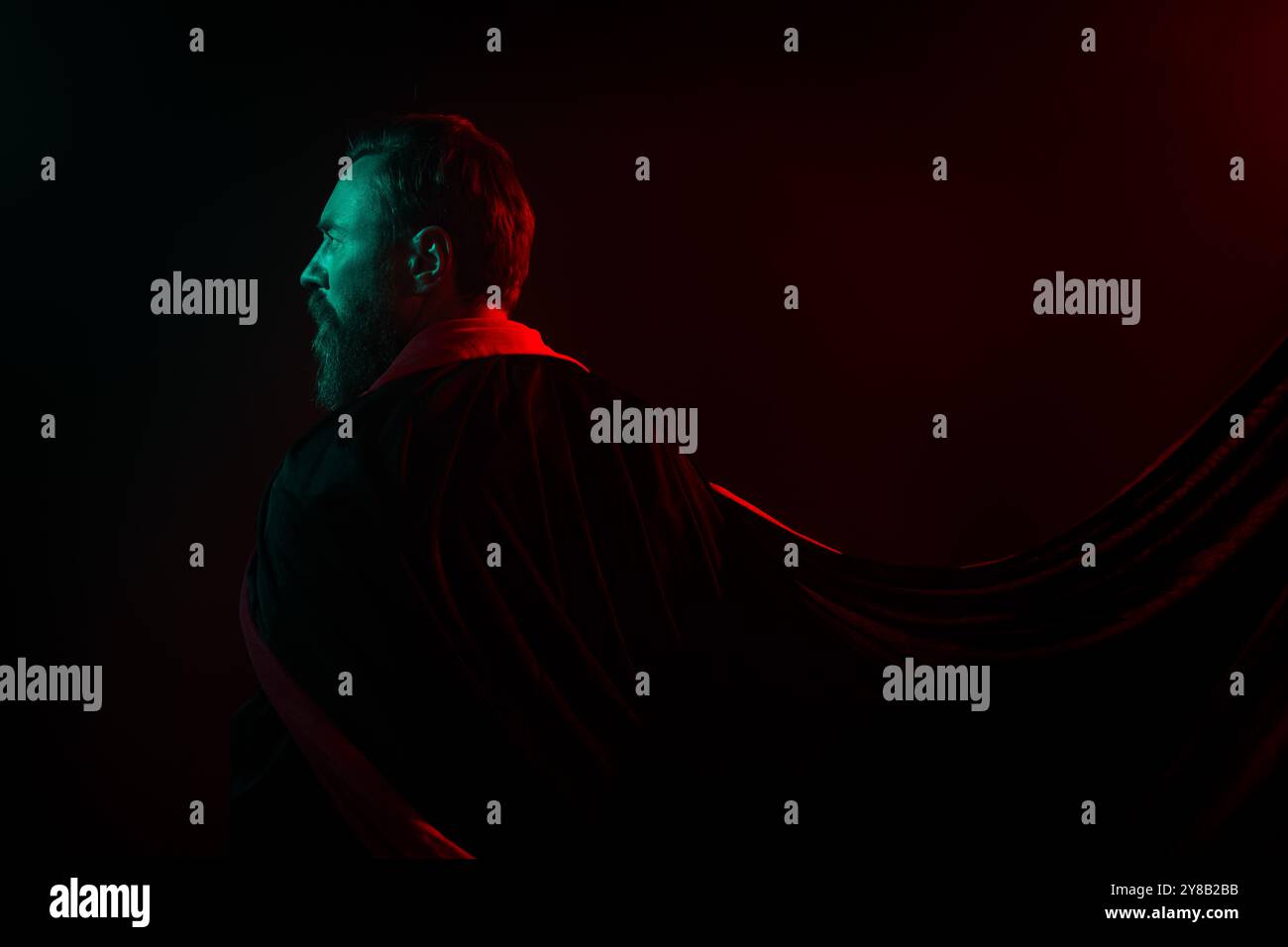 Photo of spooky handsome retired man back view fluttering cape ...