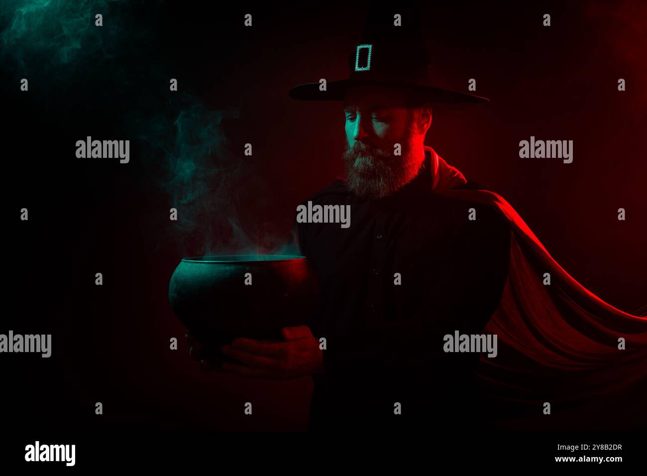 Photo of mysterious serious retired man brew evil potion hold cauldron ...