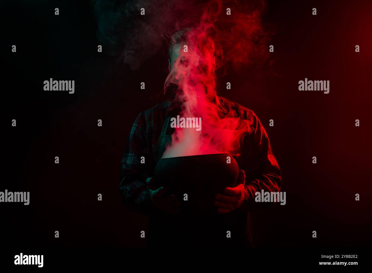 Photo of sorcerer conjurer hold cauldron make conducting ritual ...