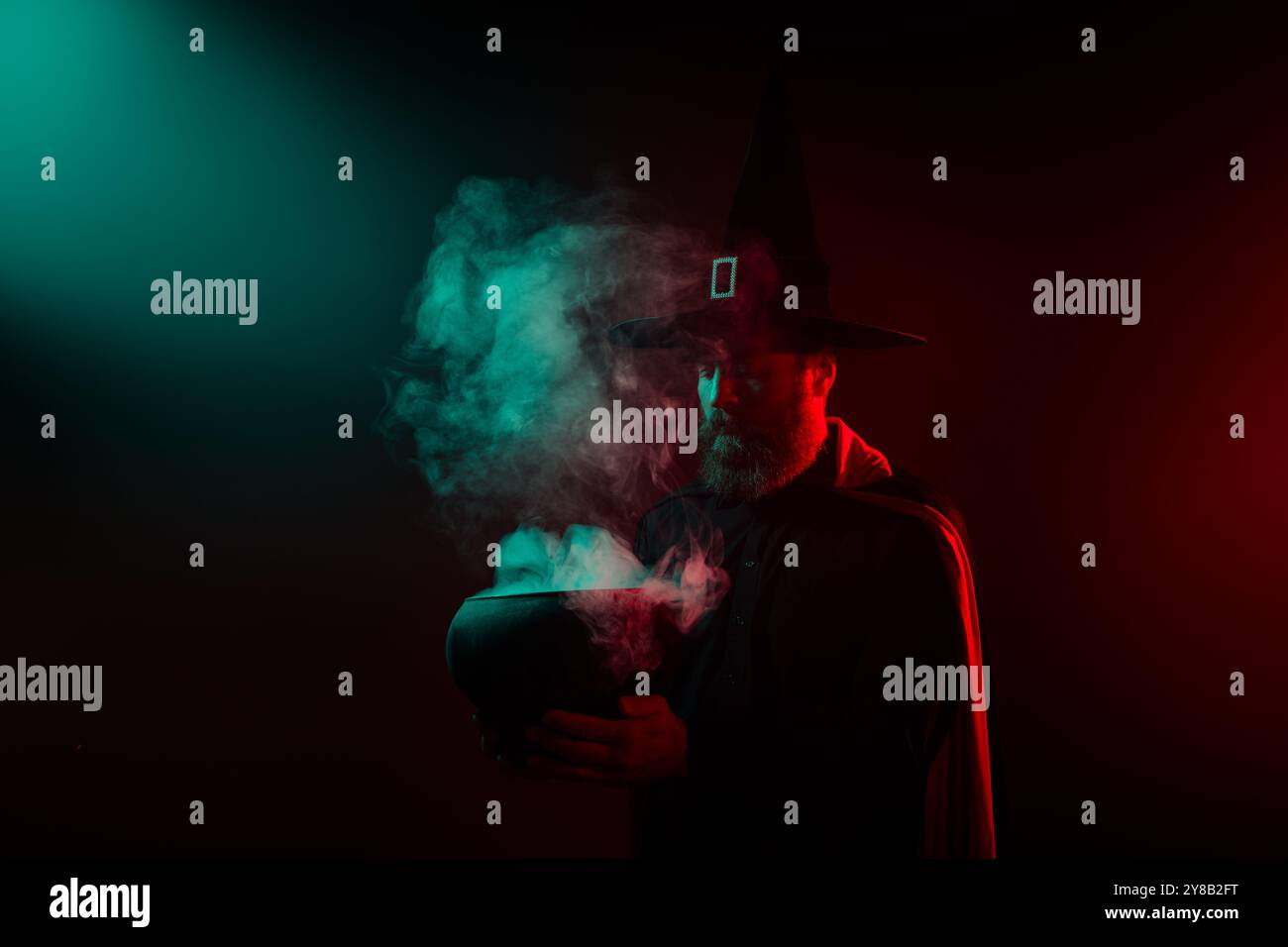 Photo of sorcerer hold cauldron halloween event make magic ritual ...