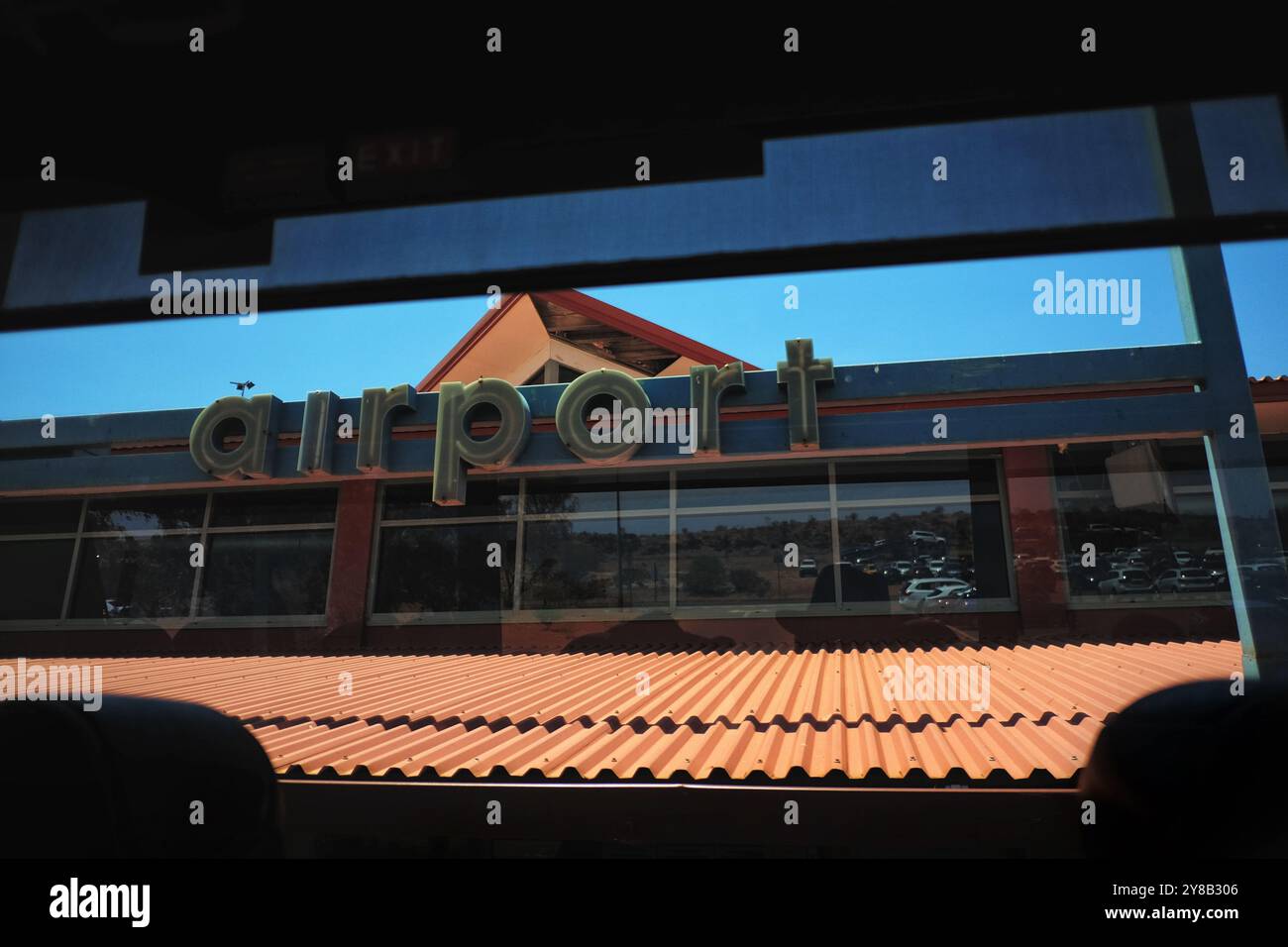 Front view of Ayers Rock Airport, Airport sign at Yulara, Uluru ...