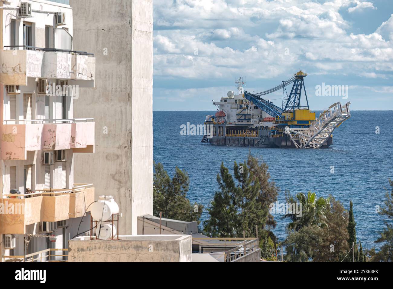 Offshore construction vessel is laying a subsea pipeline in the sea ...