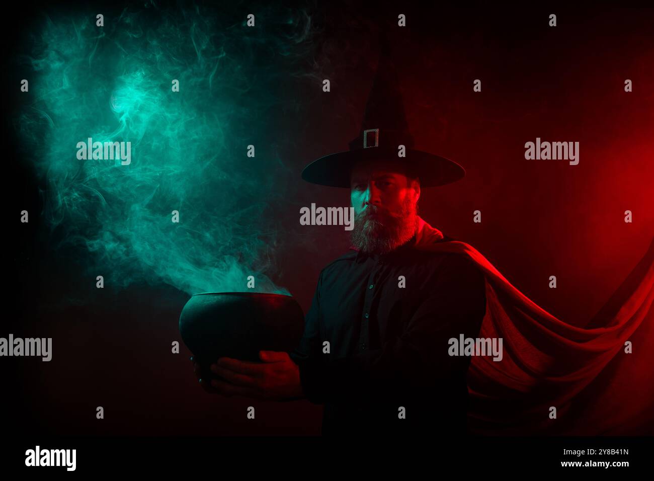 Photo of wizard warlock hold cauldron make magic ritual halloween ...