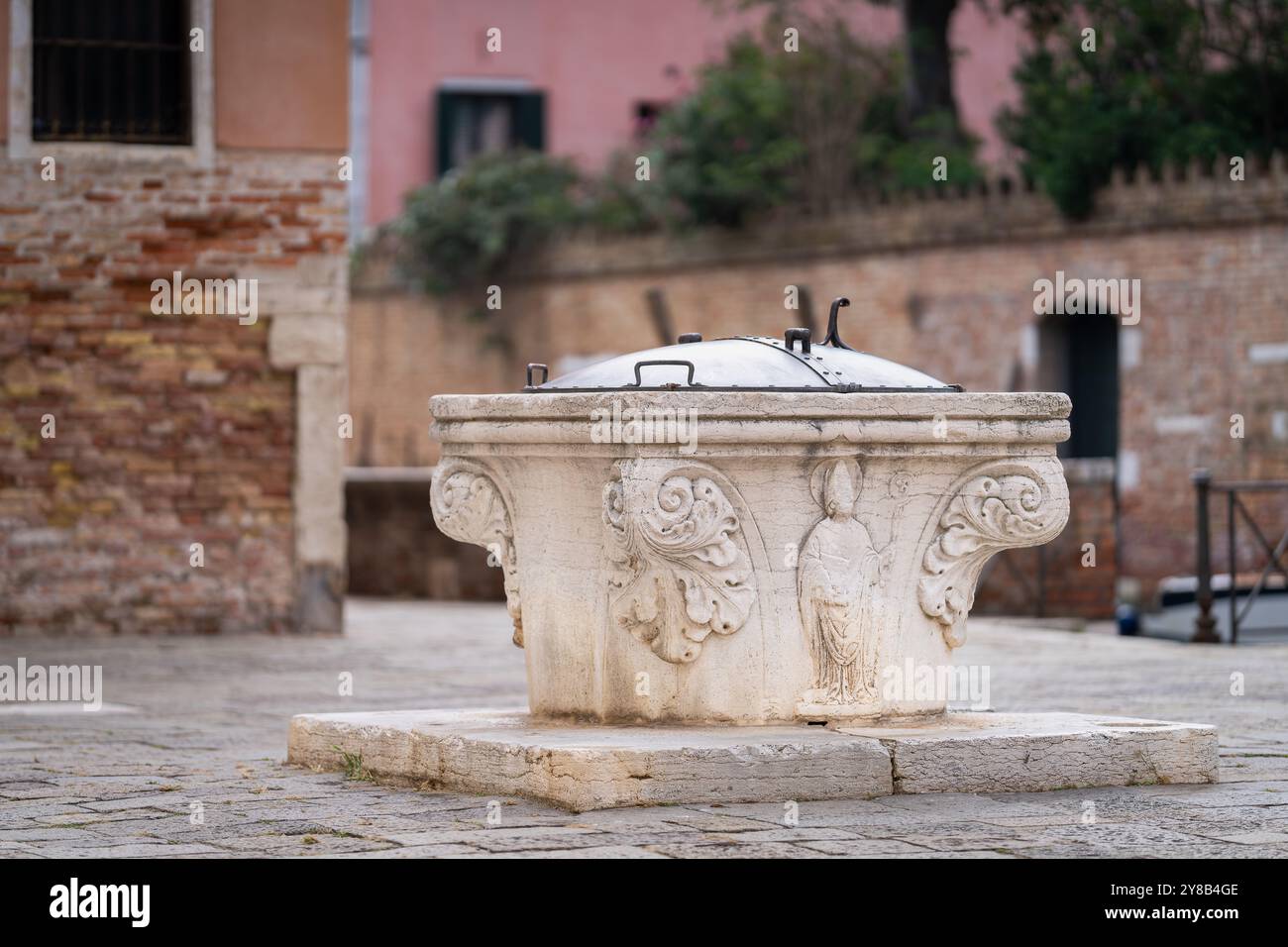 Old water well in Venice, Italy. Close-up of an ancient marble well for ...