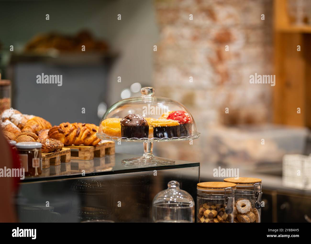 Display of baked goods in the cafe. Various sweets and desserts in the ...