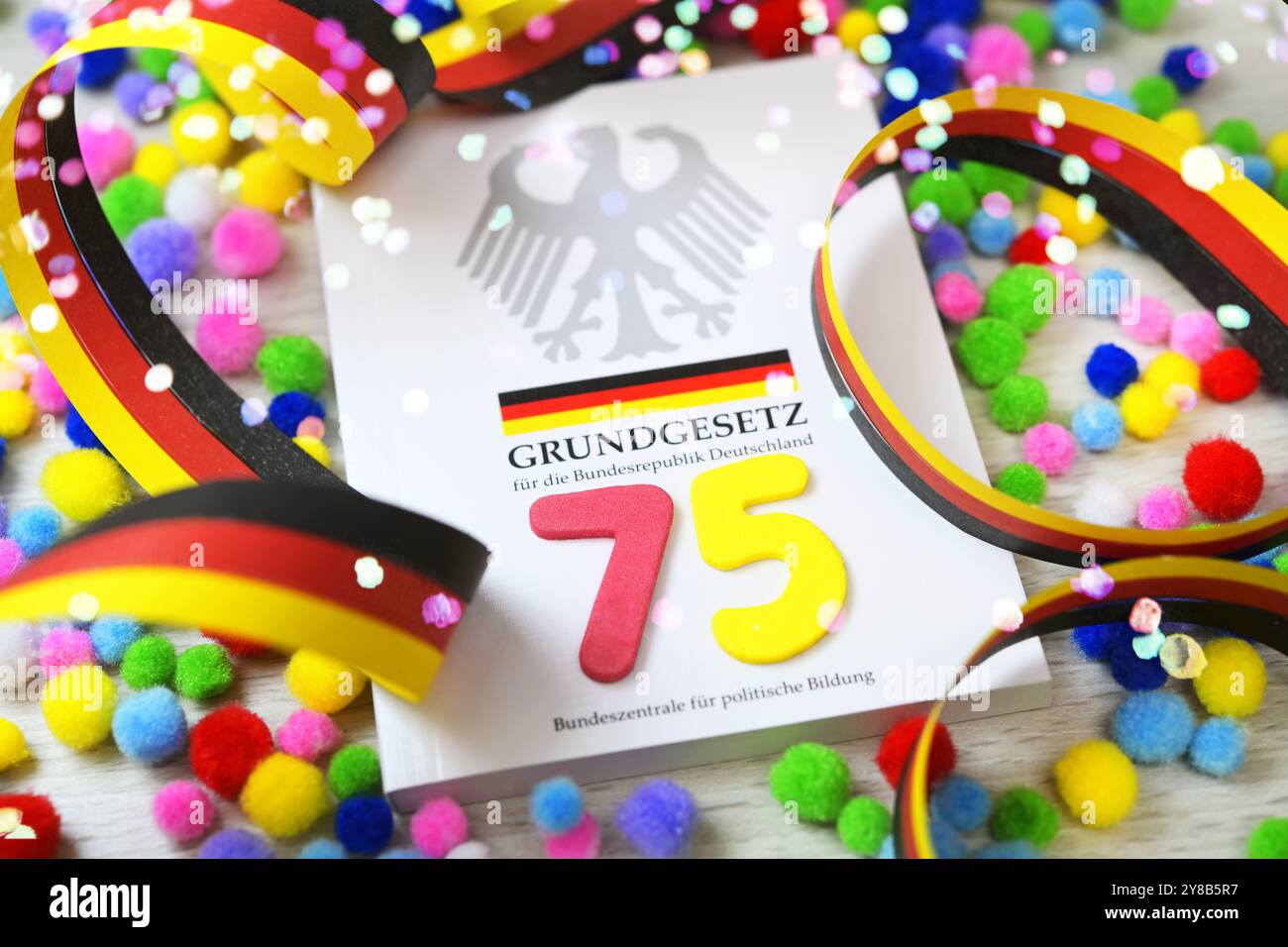 PHOTO MONTAGE, German Basic Law with the number 75, confetti and ...