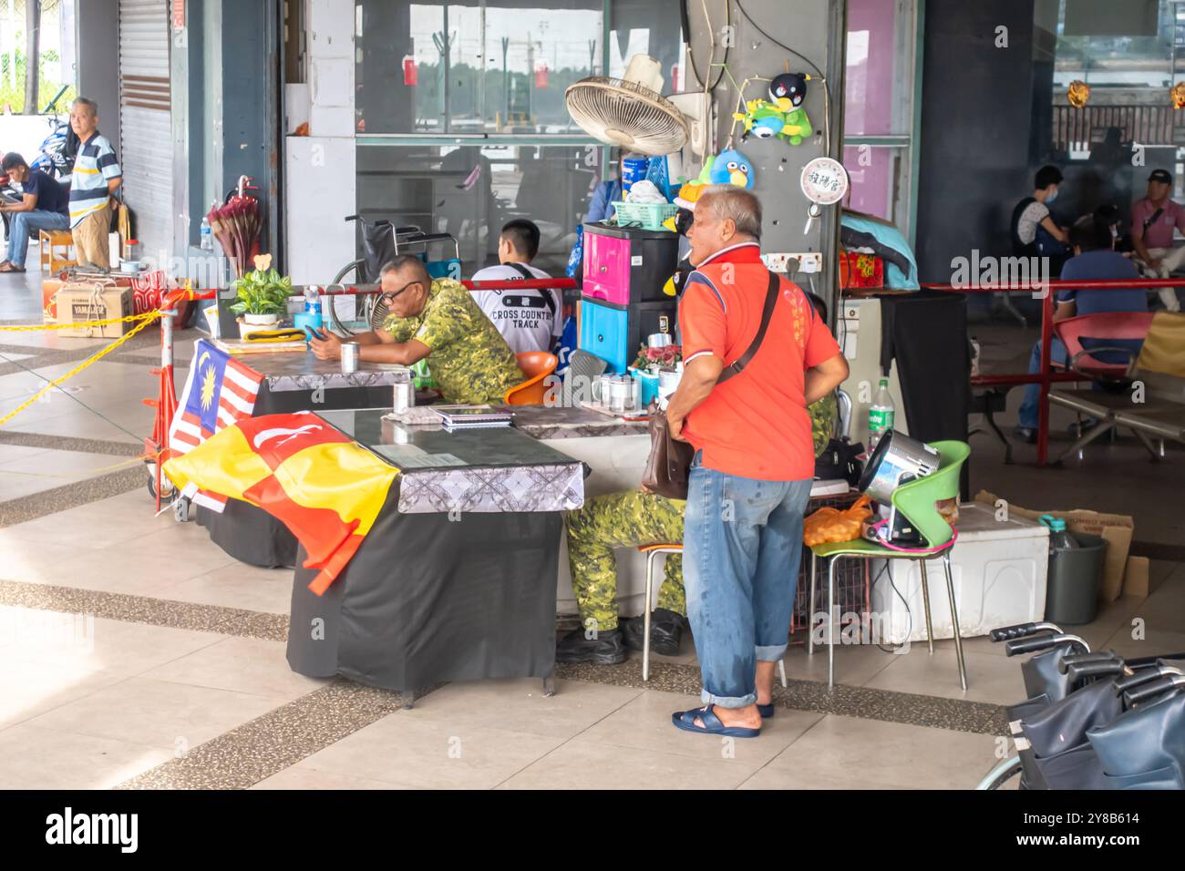 Security staff in passenger terminal of Klang port, Malaysia Stock ...