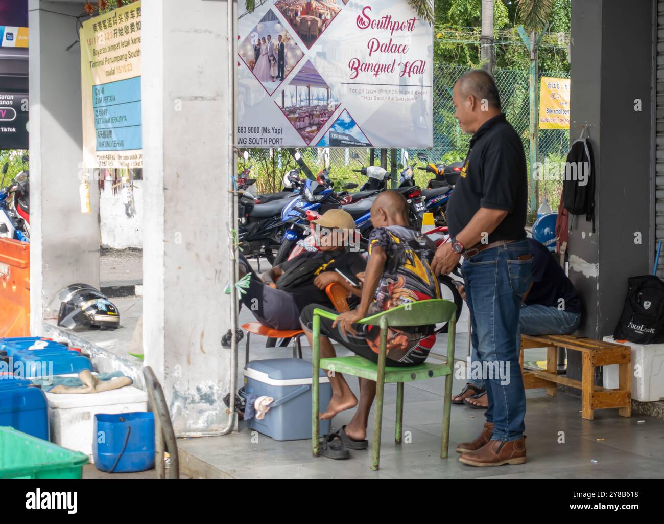 Security staff in passenger terminal of Klang port, Malaysia Stock ...
