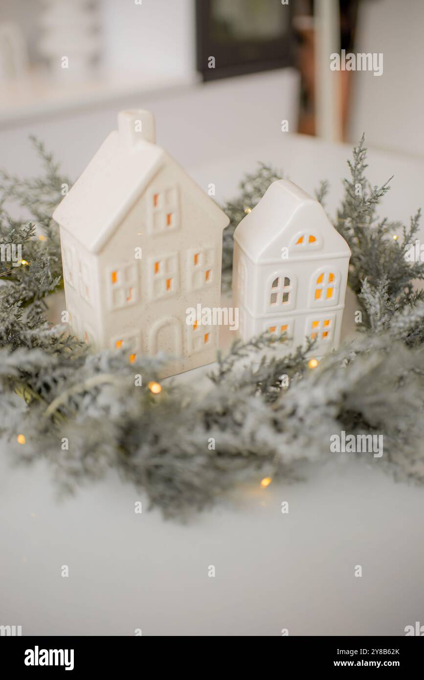 Miniature houses and fir trees on white background. Cozy small world ...