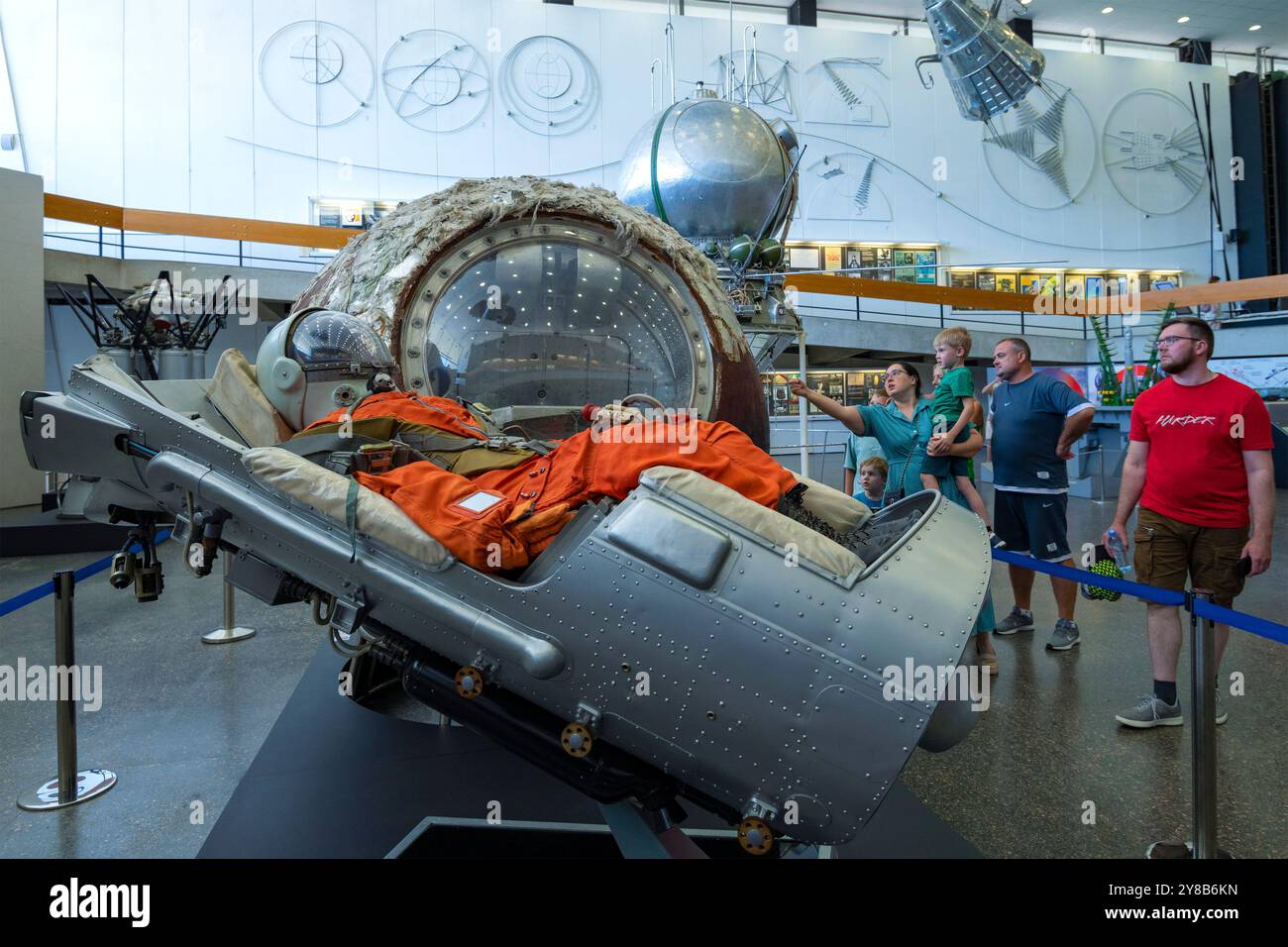 KALUGA, RUSSIA - JULY 14, 2024: A family examines the descent module and ejection seat of the ...