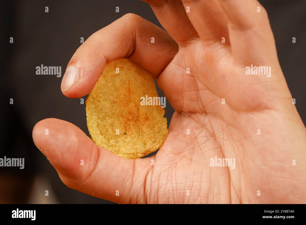 Unhealthy lifestyle. Man eating potato chips. Fast food. Junk food ...