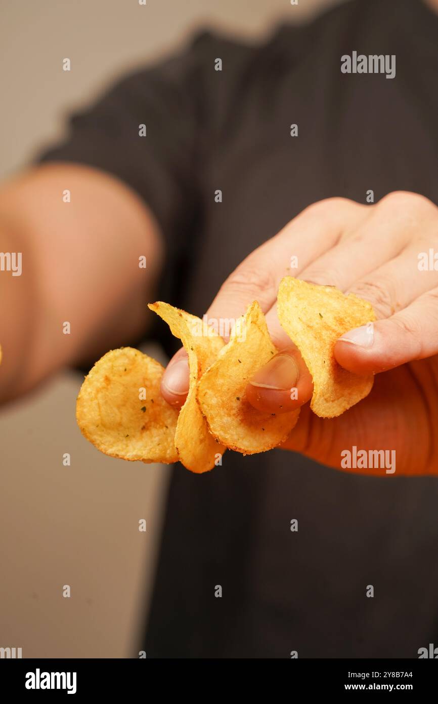 Fast food. Junk food. Hands hold potato chips. Calories. Obesity ...