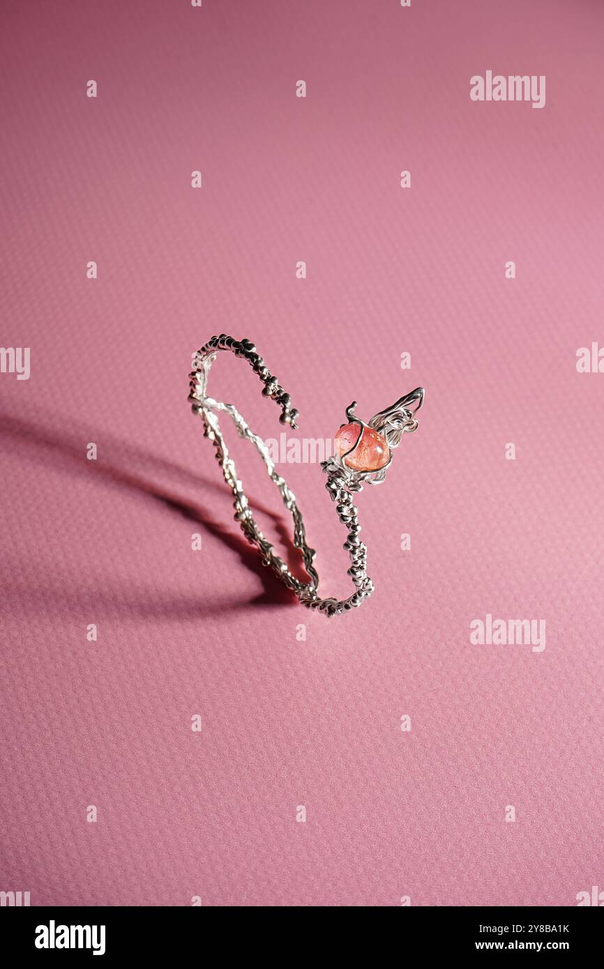 Side view of gem ring detail. A ring in a modern avant-garde style ...