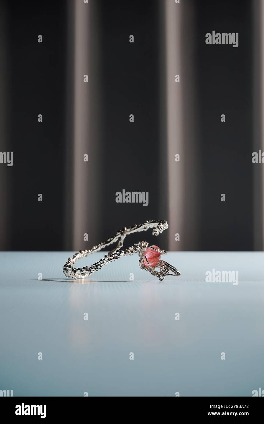 Side view of gem ring detail. A ring in a modern avant-garde style ...