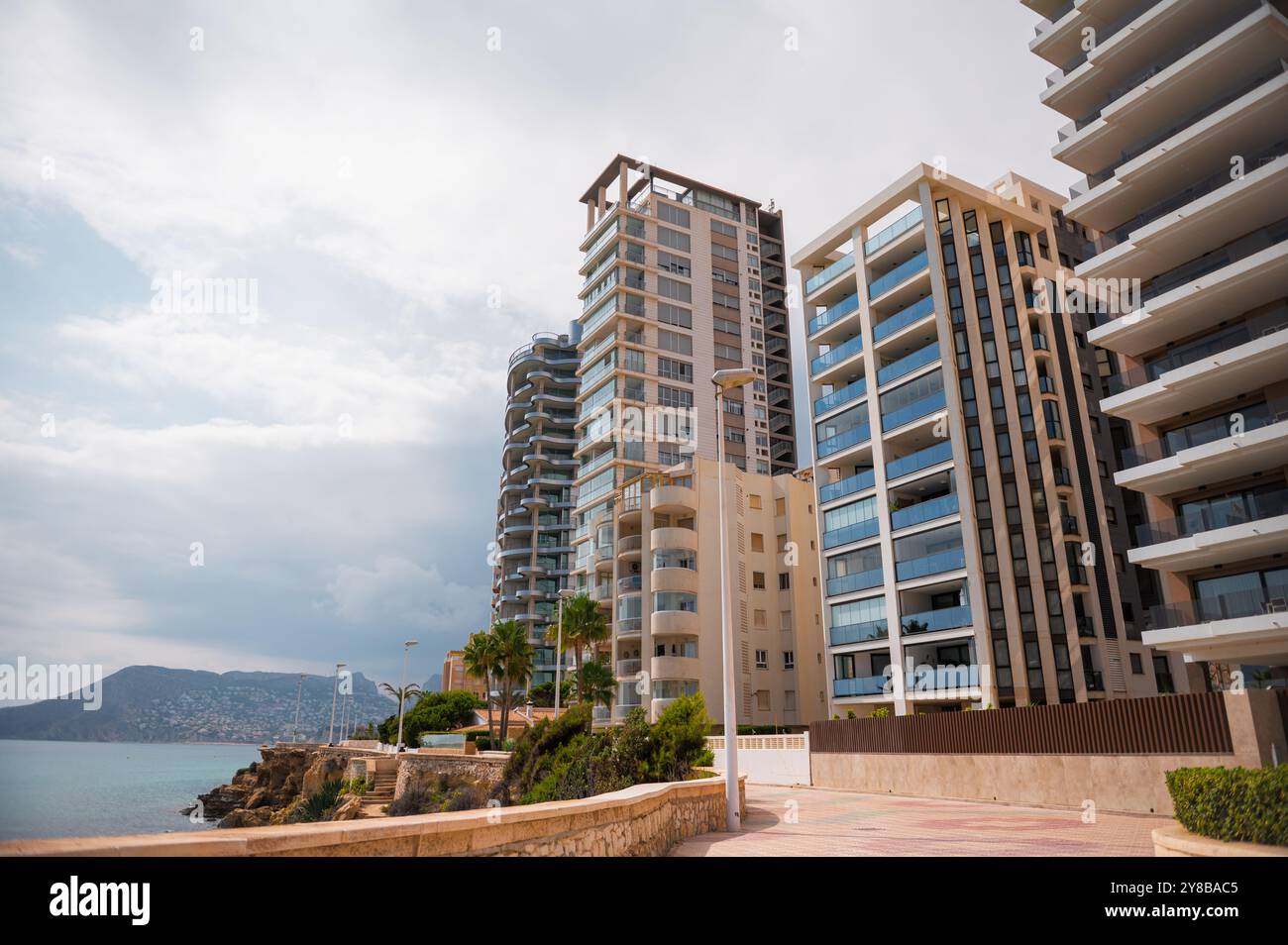 Contemporary high-rise residential buildings by the ocean, featuring ...