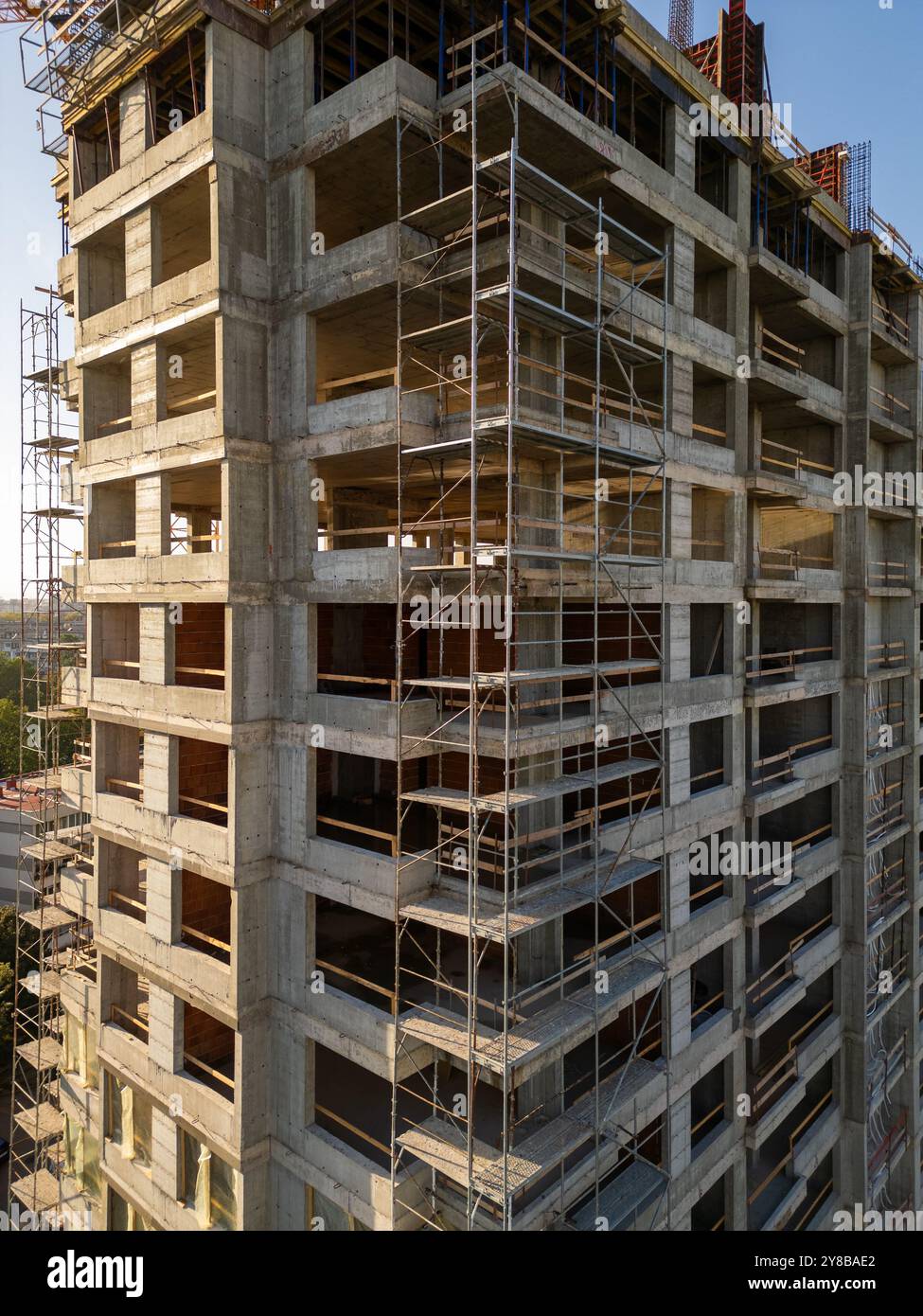 A drone video capturing the construction site of a high-rise building ...