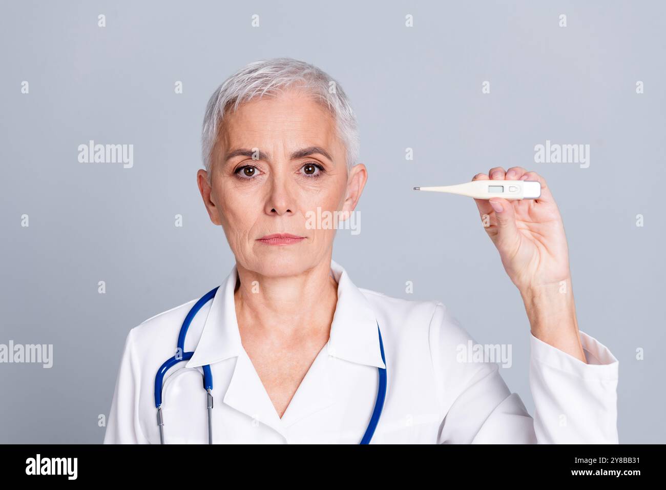 Photo of aged lady professional doctor hold thermometer wear white coat ...