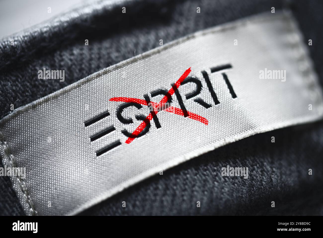 PHOTO MONTAGE, crossed-out label of the fashion brand Esprit on a ...