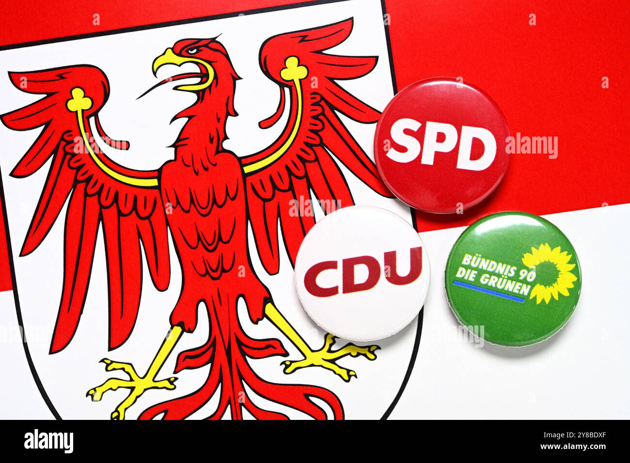 Party badges of SPD, CDU and Greens on the coat of arms of Brandenburg ...