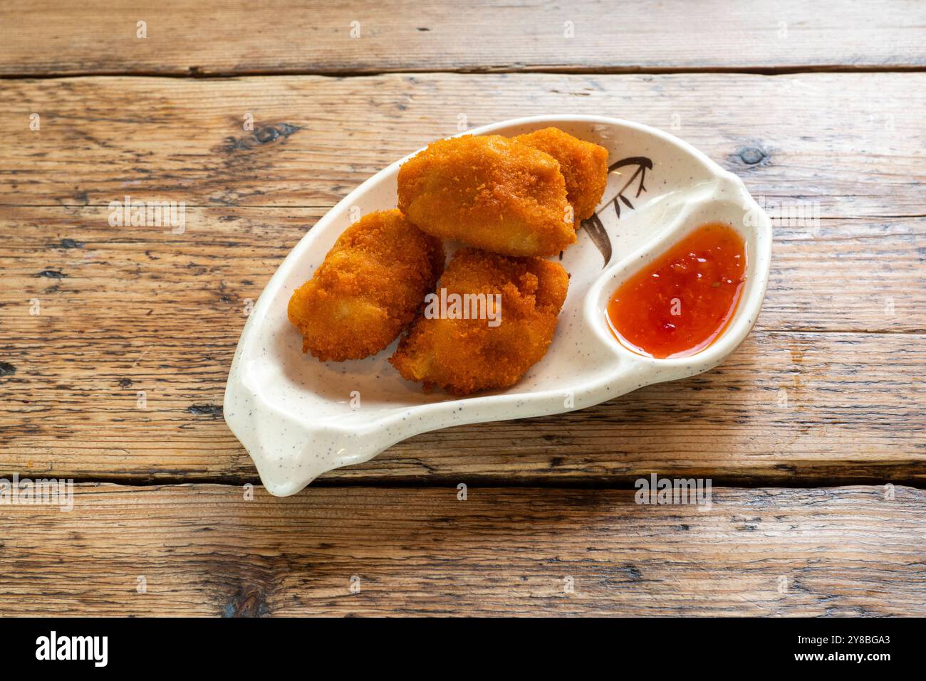 Mock Chicken Drumstick served with a sweet and sour sauce dip Stock ...