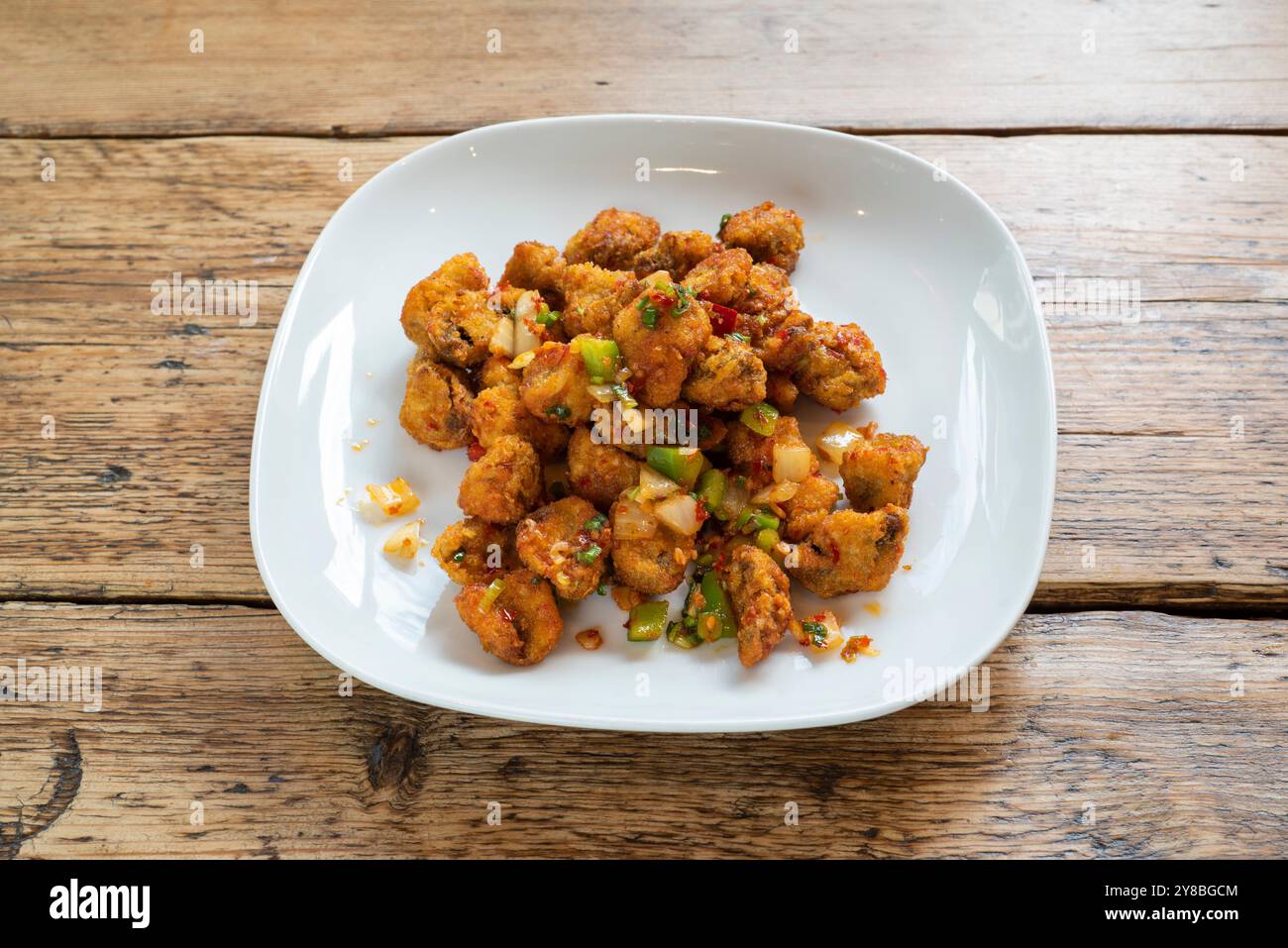 Salt and Chilli mushrooms vegetarian friendly Asian meal Stock Photo ...