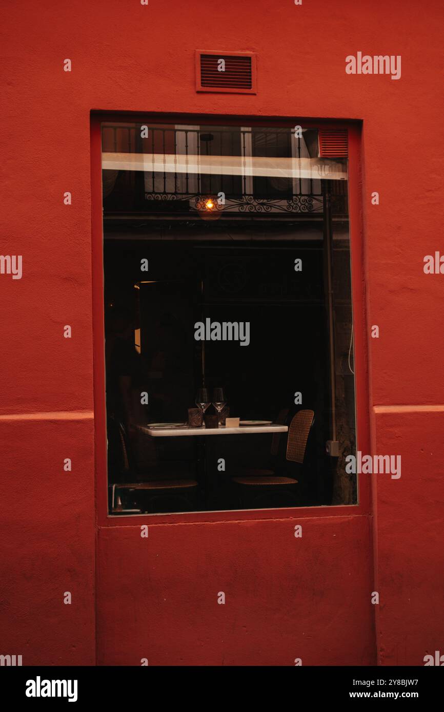 Bloody red facade of building with large window of cafe, restaurant ...
