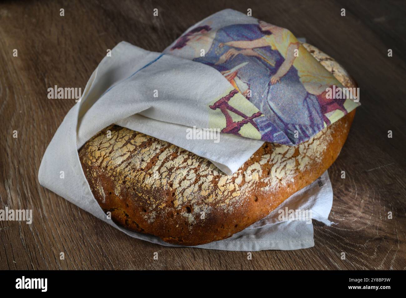 Traditional leavened sourdough bread with rought skin on a rustic ...