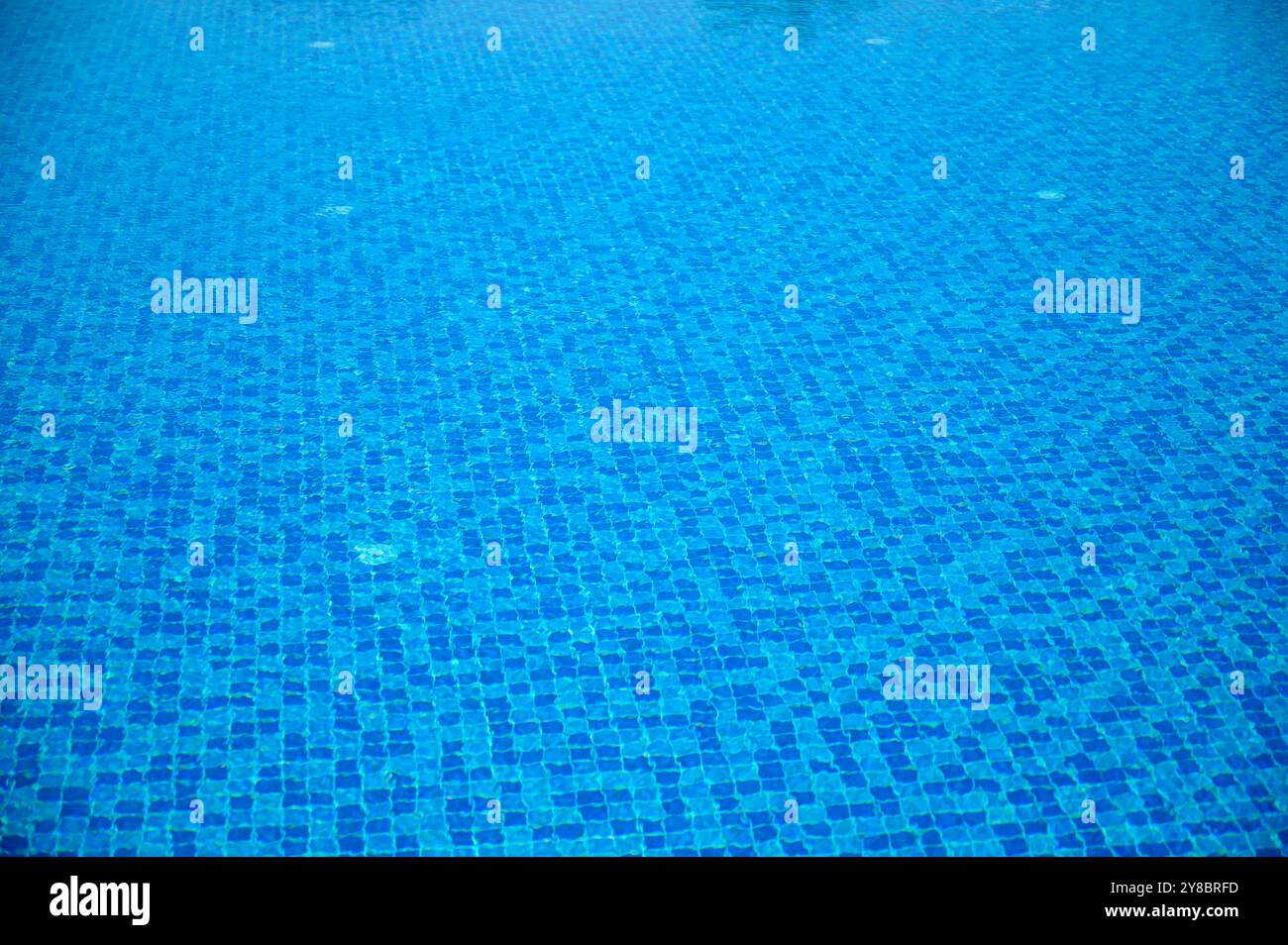 Blue water in the swimming pool with light reflections Stock Photo - Alamy