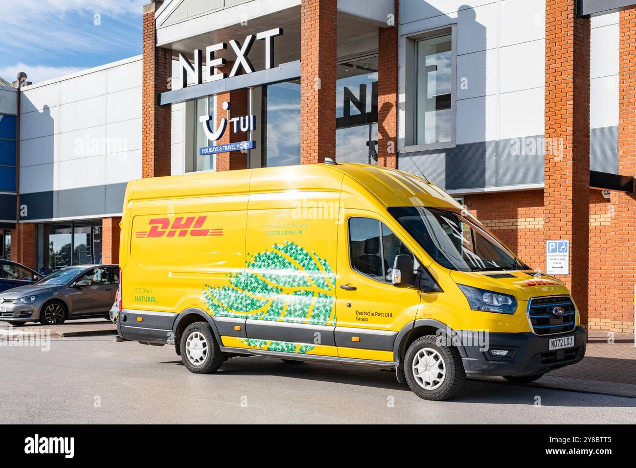 DHL delivery electric van going green Stock Photo - Alamy
