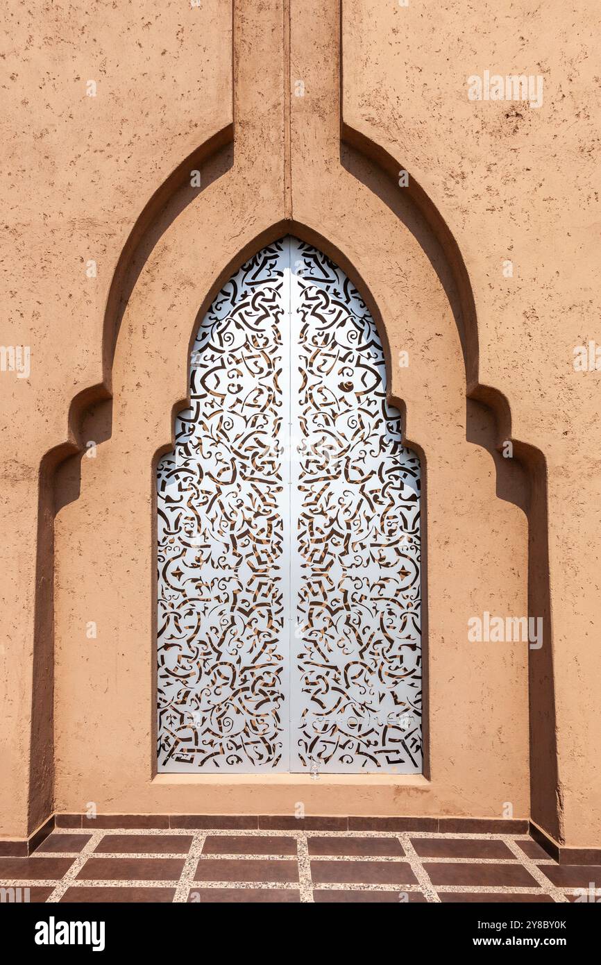Large window of a modern building, but with a mashrabiya as a screen ...