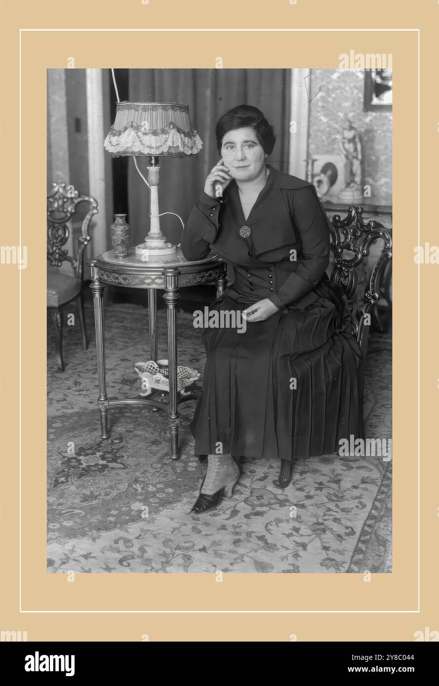 Amy Castles, full length portrait, seated, facing mostly left ...