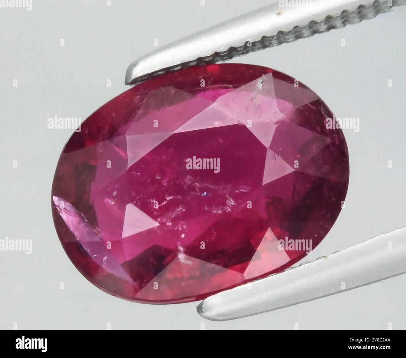 Radiant Oval Cut Pink Ruby Gemstone Displayed with Precision Stock ...