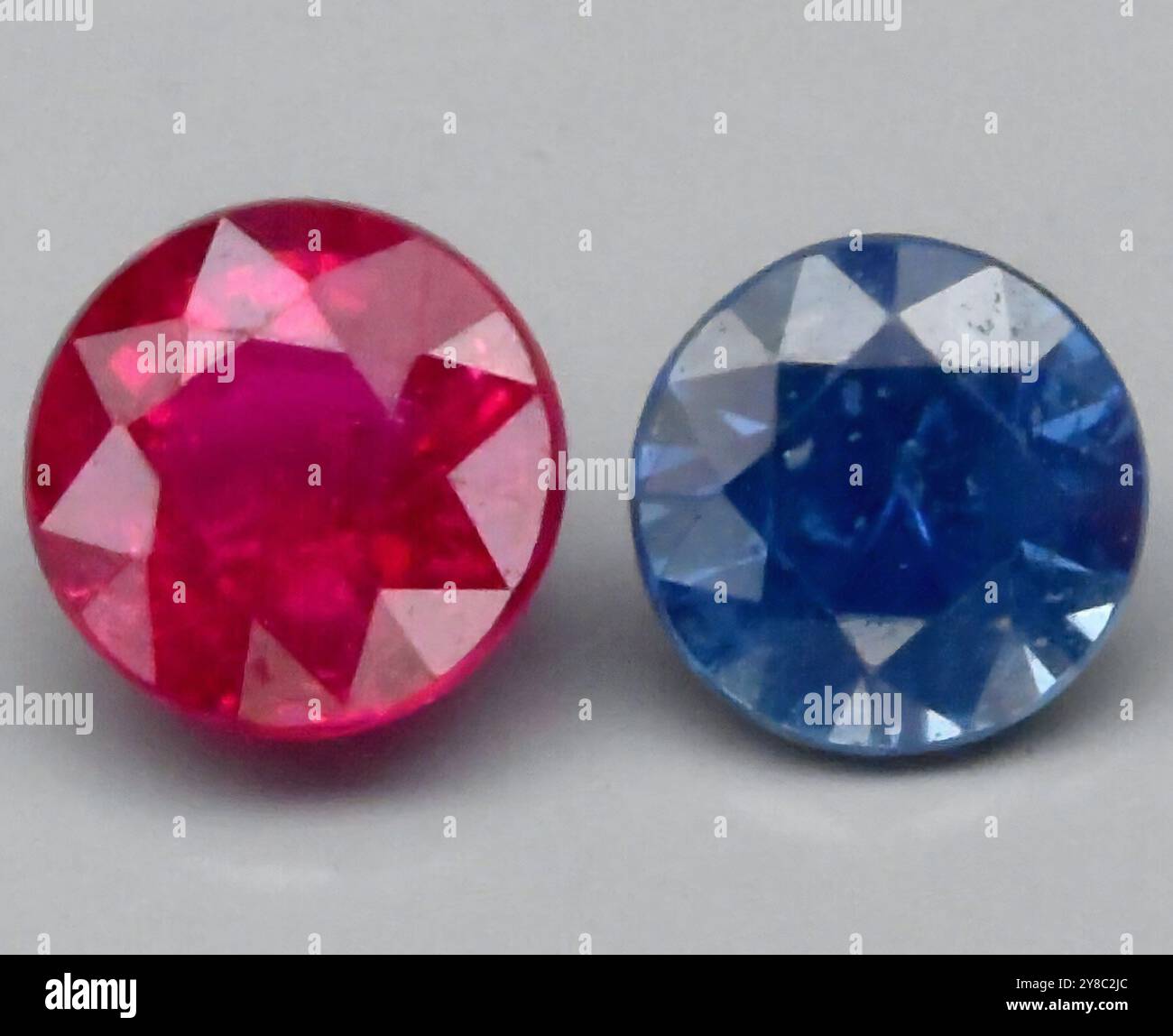 Radiant Pink and Blue Gemstones Sparkling Elegantly on a Soft ...