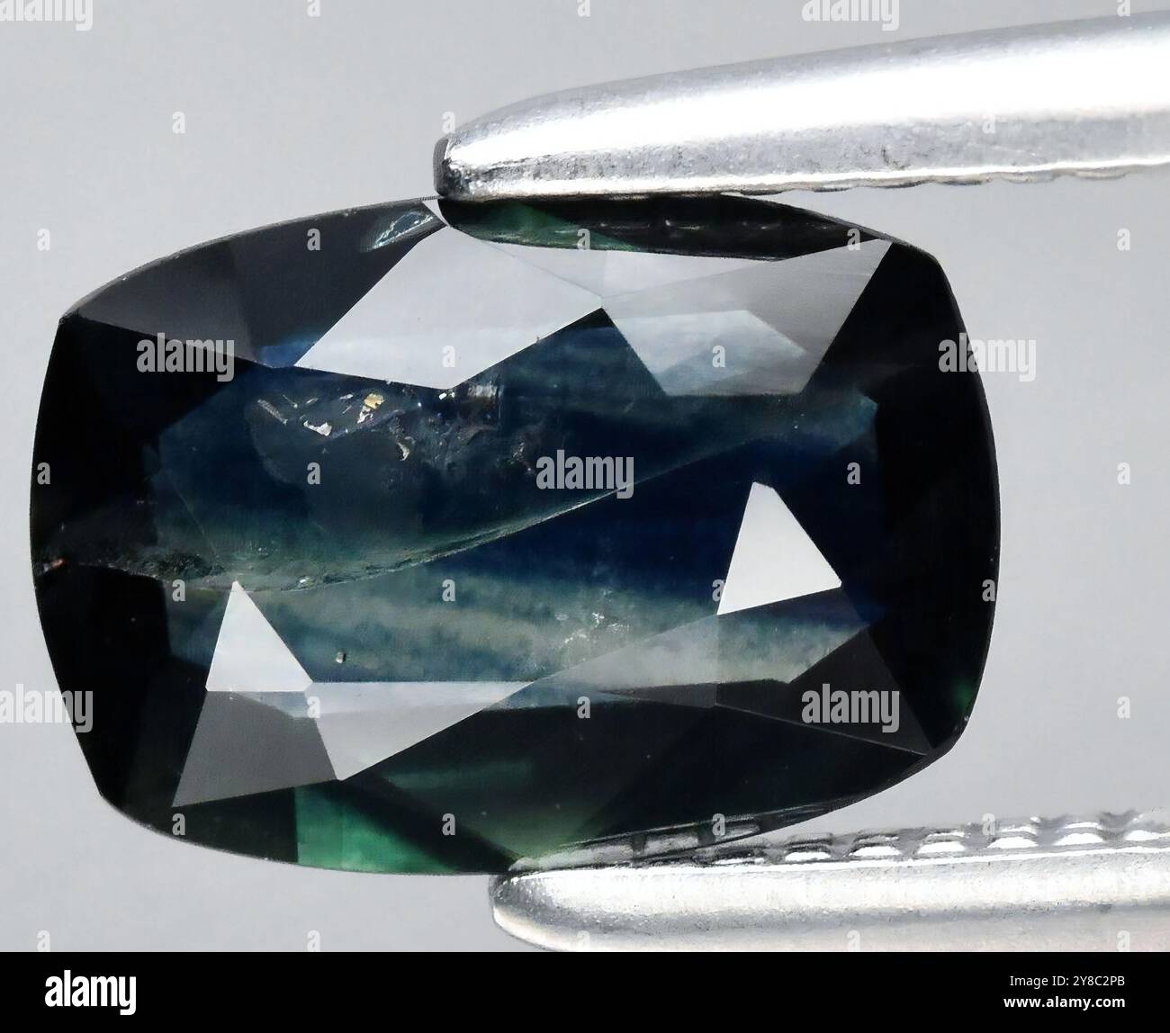 Stunning Deep Blue Gemstone with Intricate Faceting and Glossy Finish ...